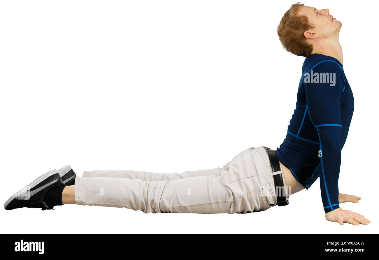 Flexible sporty young man doing stretching exercises isolated on white ...