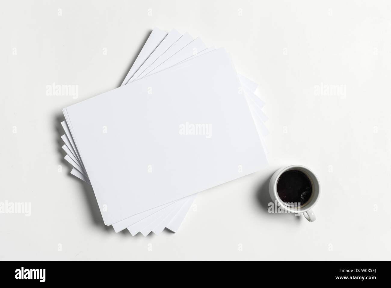 a4 paper and coffee cup Stock Photo - Alamy