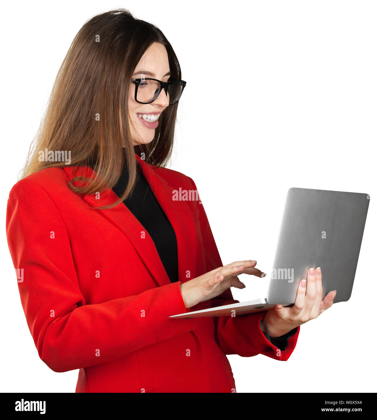 Young woman in formal outfit using her laptop isolated on white ...