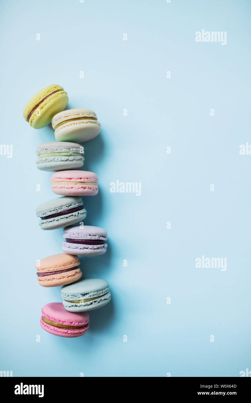 Cake macaron or macaroon on pastel blue background from above ...