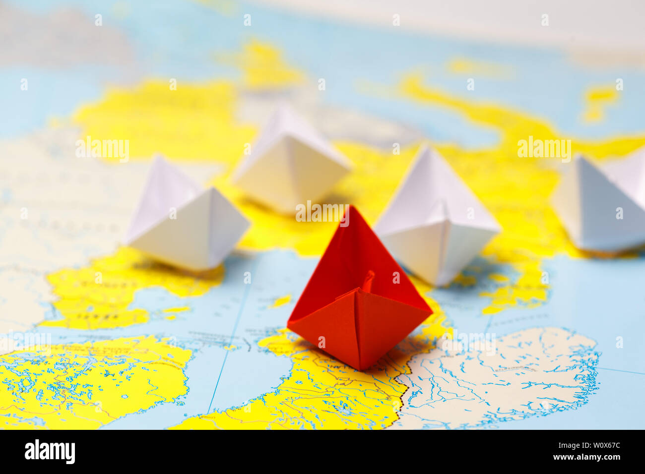 Origami paper ship on a map. Leadership and travelling concept Stock ...