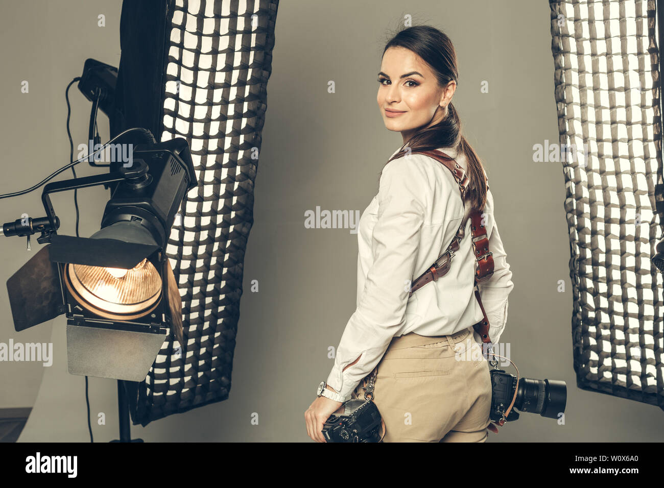 Pretty woman is a professional photographer with dslr camera Stock ...