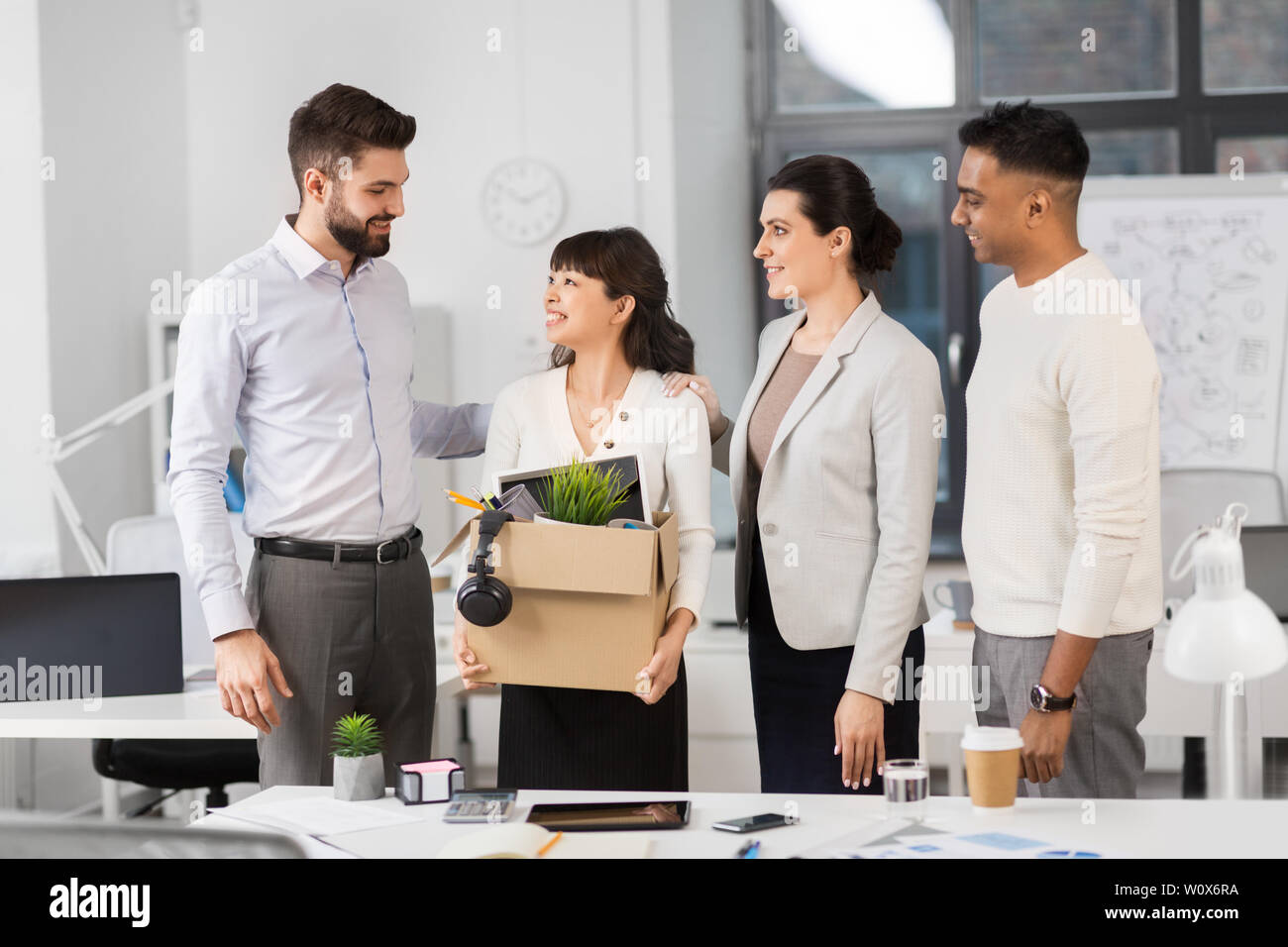 new female employee with colleagues at office Stock Photo - Alamy