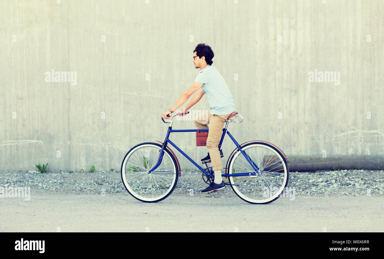 young hipster man riding fixed gear bike Stock Photo - Alamy