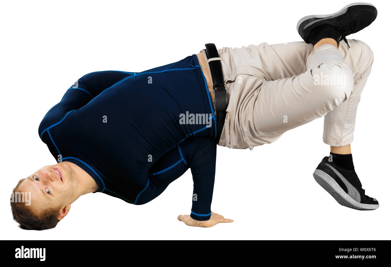 Flexible sporty young man doing stretching exercises isolated on white ...