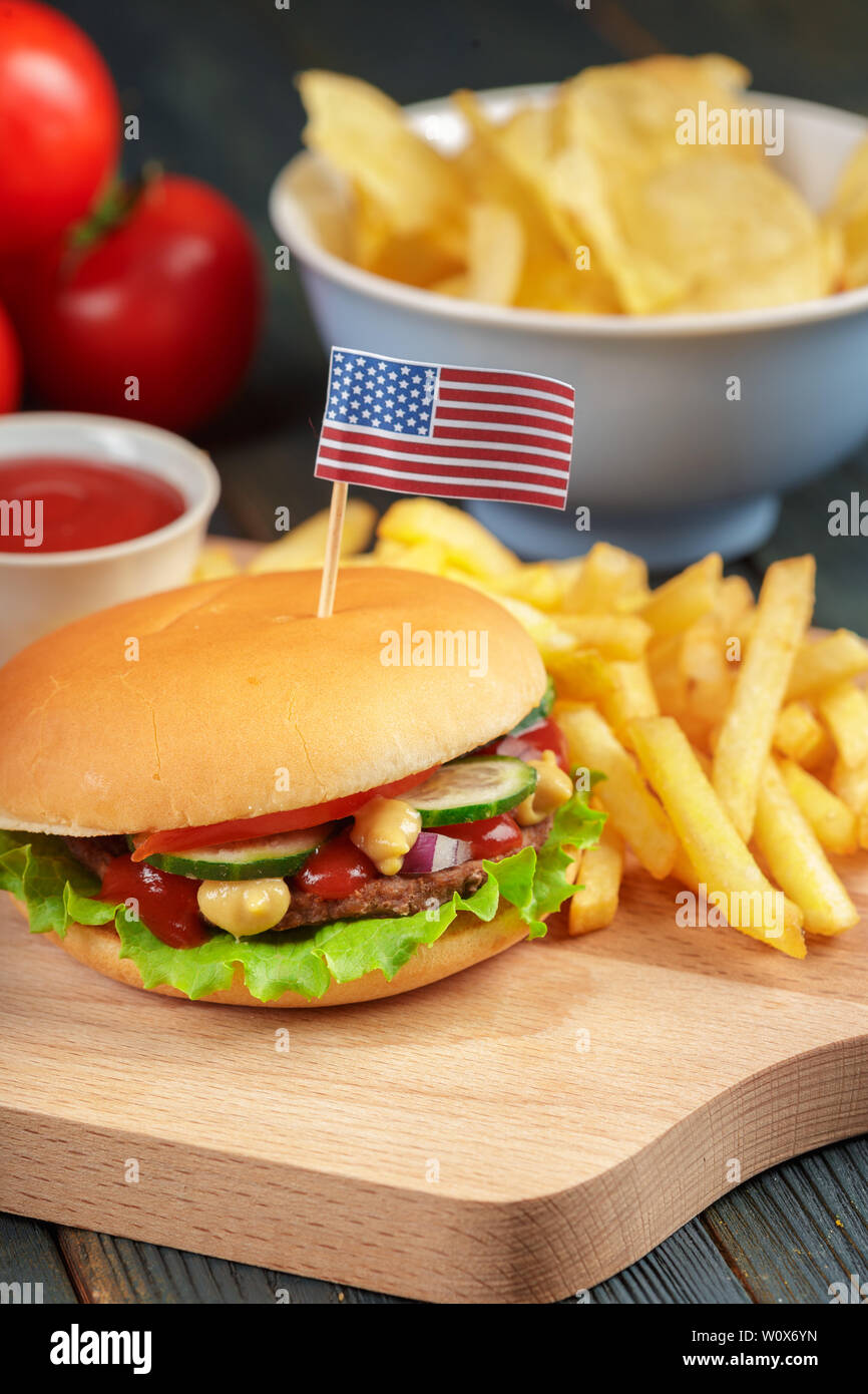 Fast food, homemade burger on a wooden background Stock Photo - Alamy