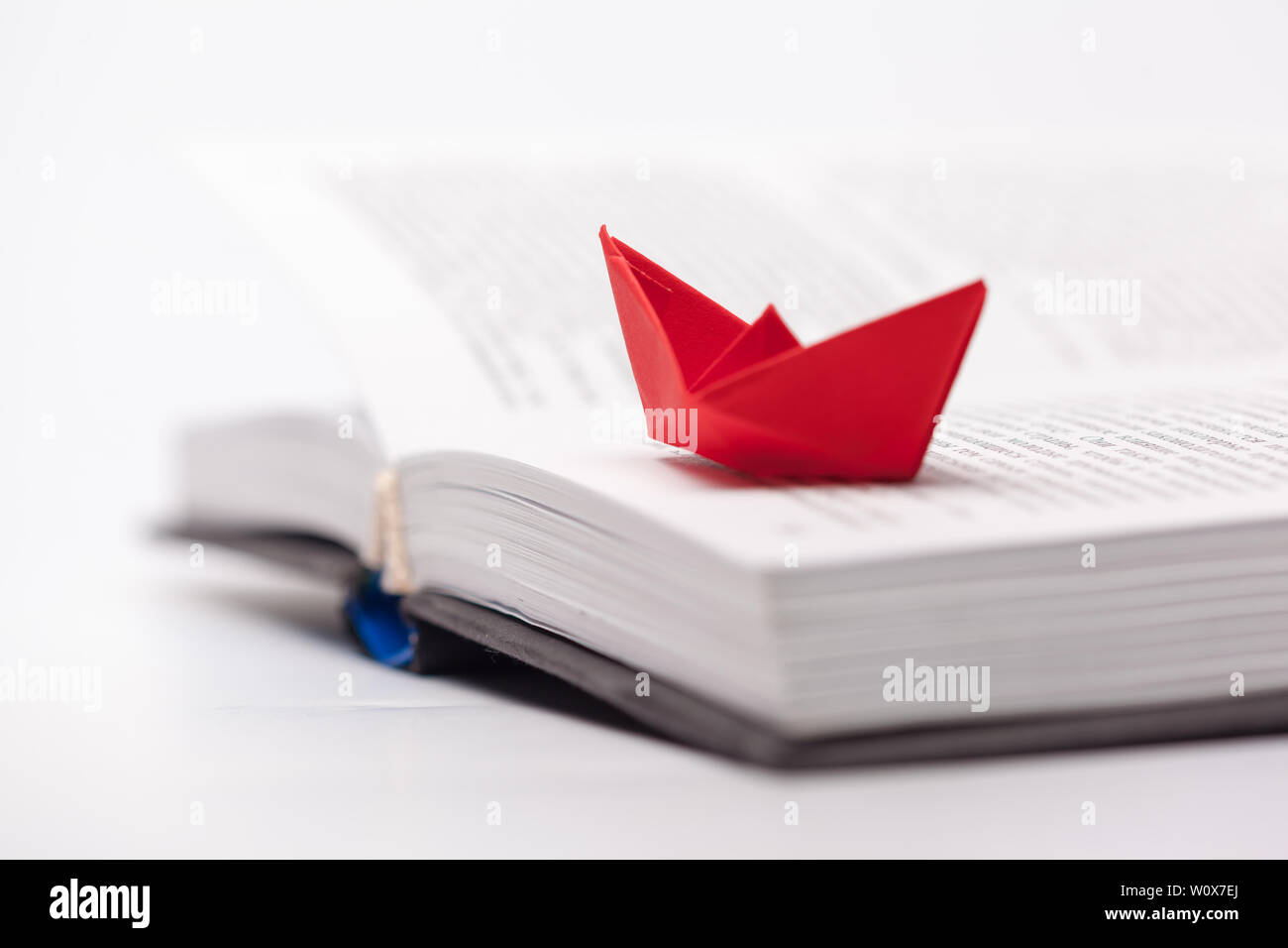 Origami boat, book hi-res stock photography and images - Alamy