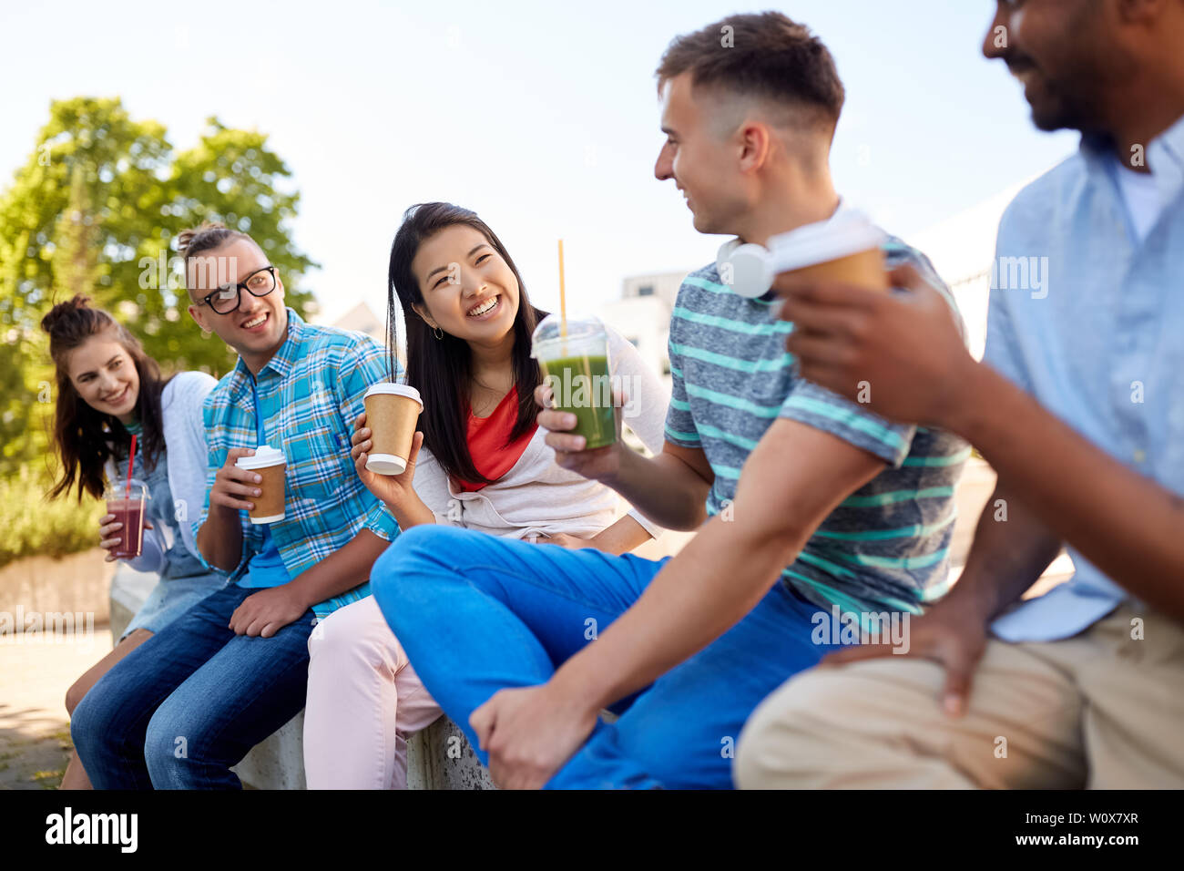 Friends drinking coffee juice talking hi-res stock photography and ...