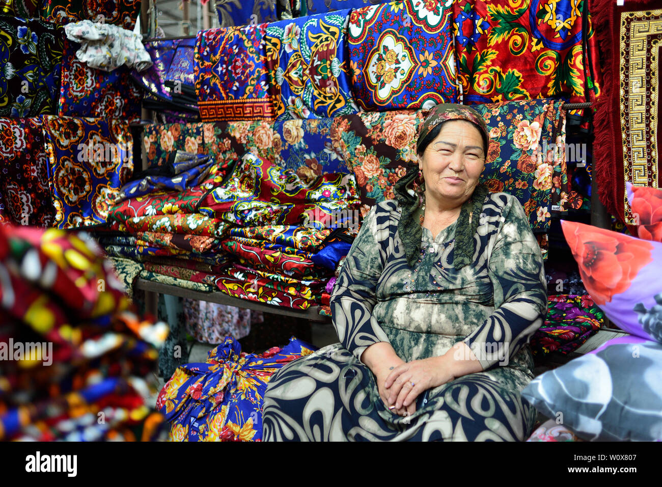 MARGILAN, FERGANA VALLEY, UZBEKISTAN - 02 JUNE 2019: Uzbek woman ...