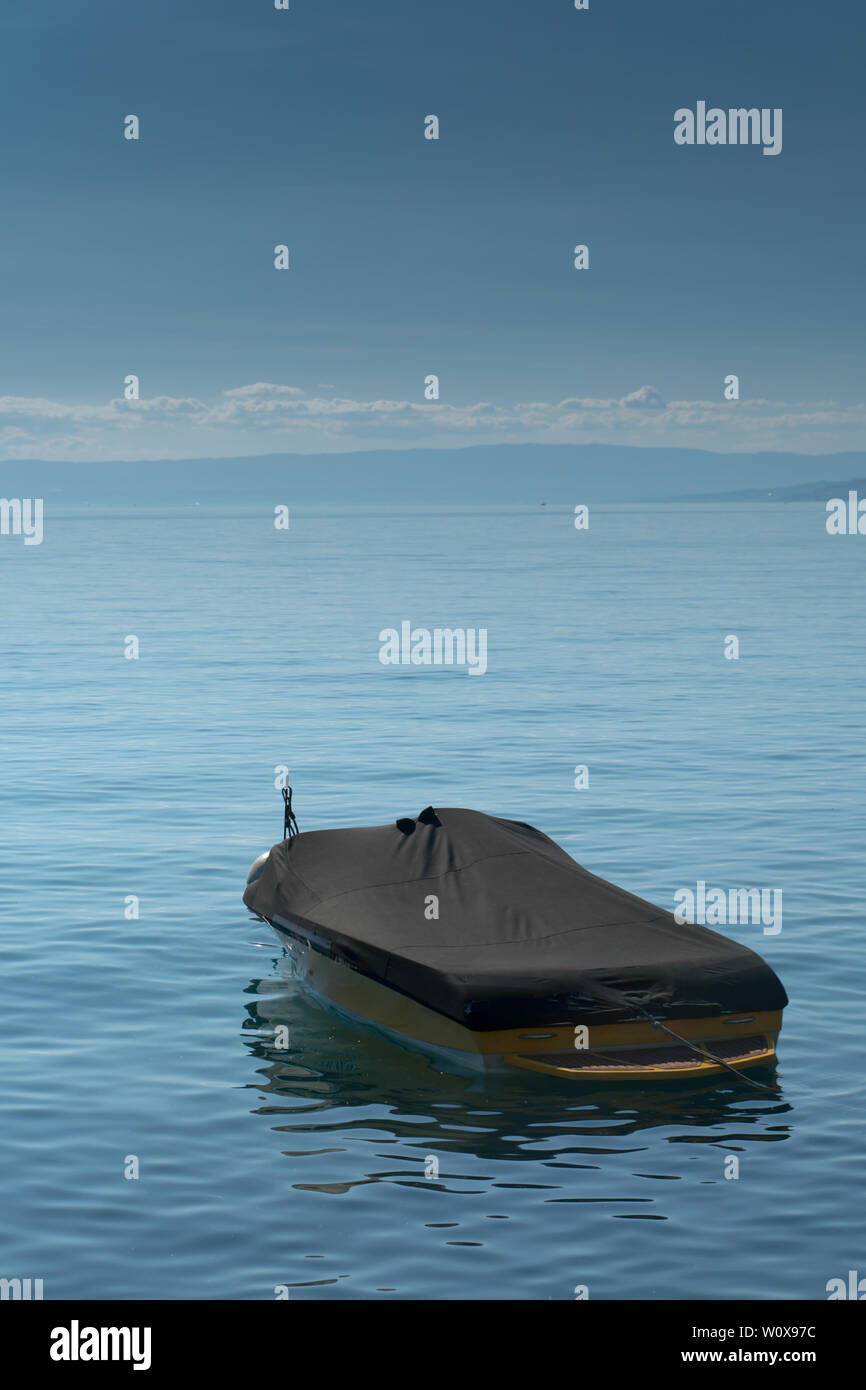 vertical Lake Geneva landscape with a single boat and copy space Stock ...