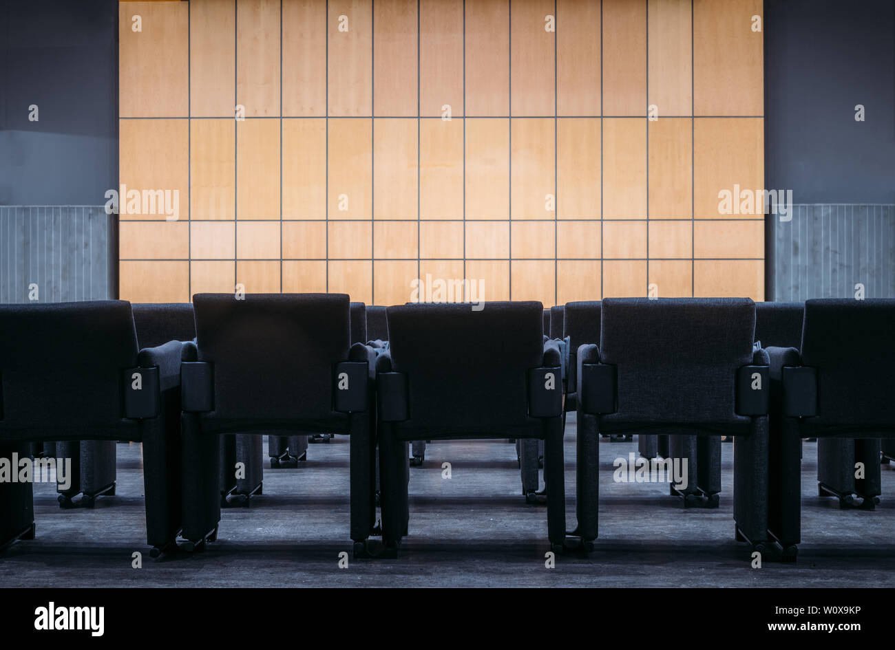 Selective perspective view towards empty audience seats and stage in ...