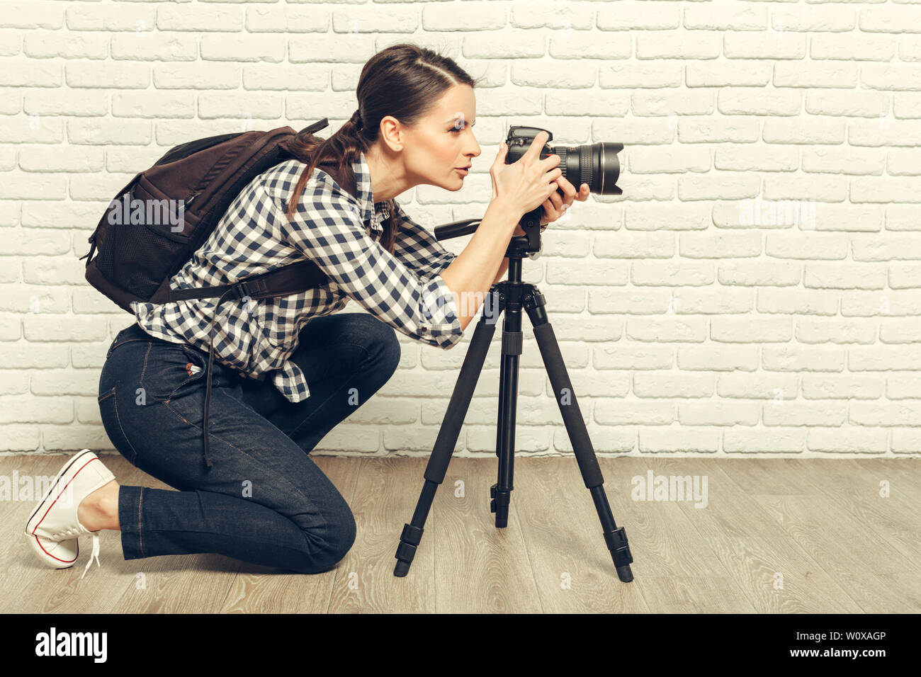 Pretty woman is a professional photographer with dslr camera Stock ...
