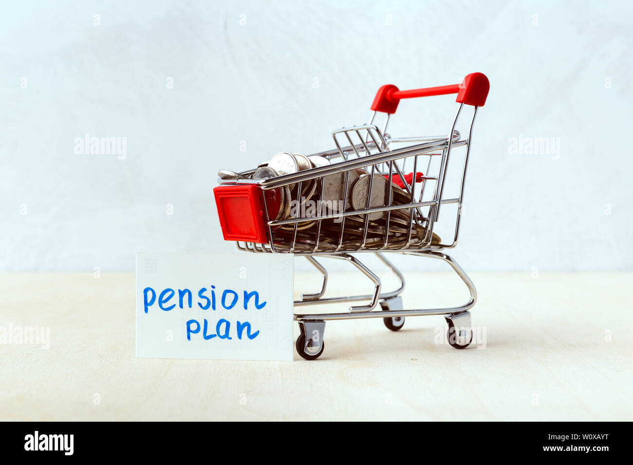 Saving Money Concept. Shopping trolley or cart with coin Stock Photo ...