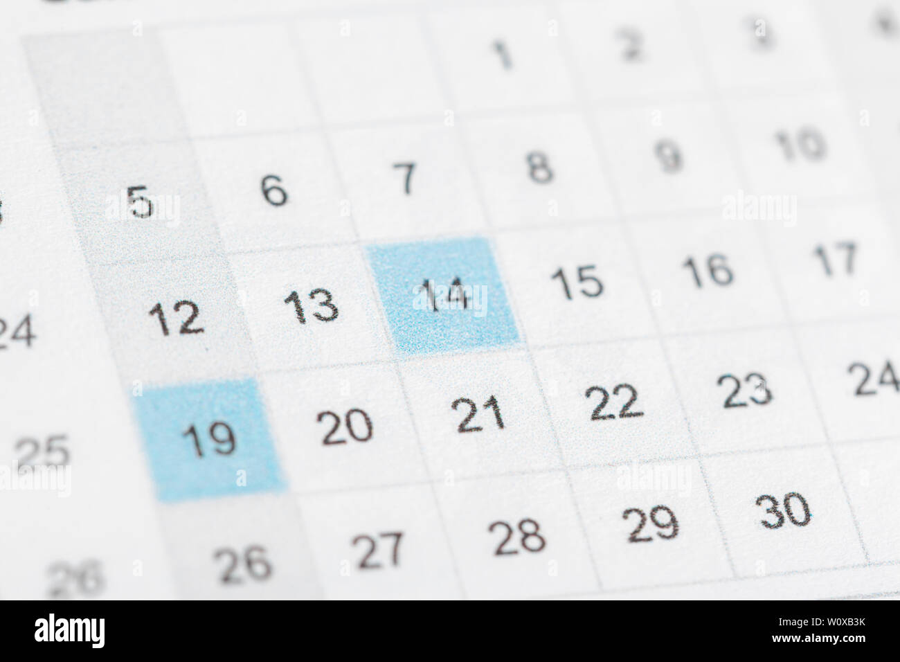 Closeup of dates on calendar page Stock Photo - Alamy