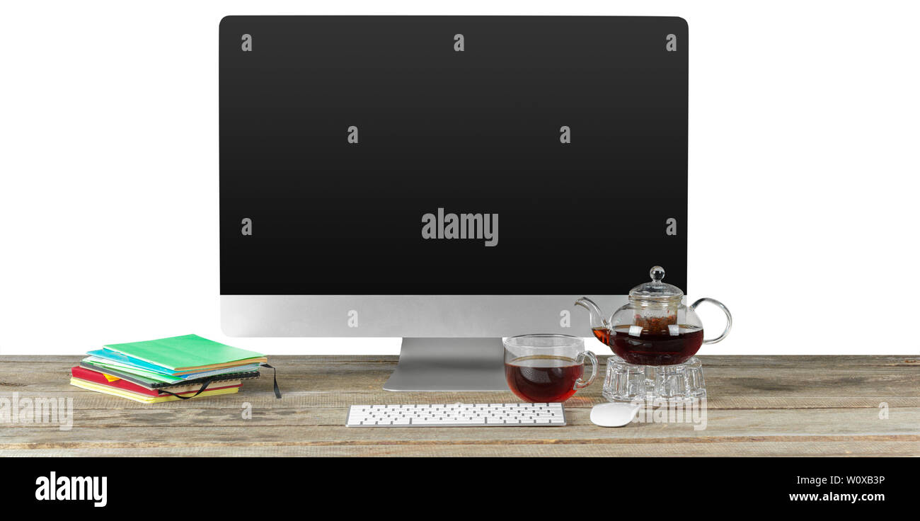 Messy table top home interior with computer monitor and keyboard. Front ...