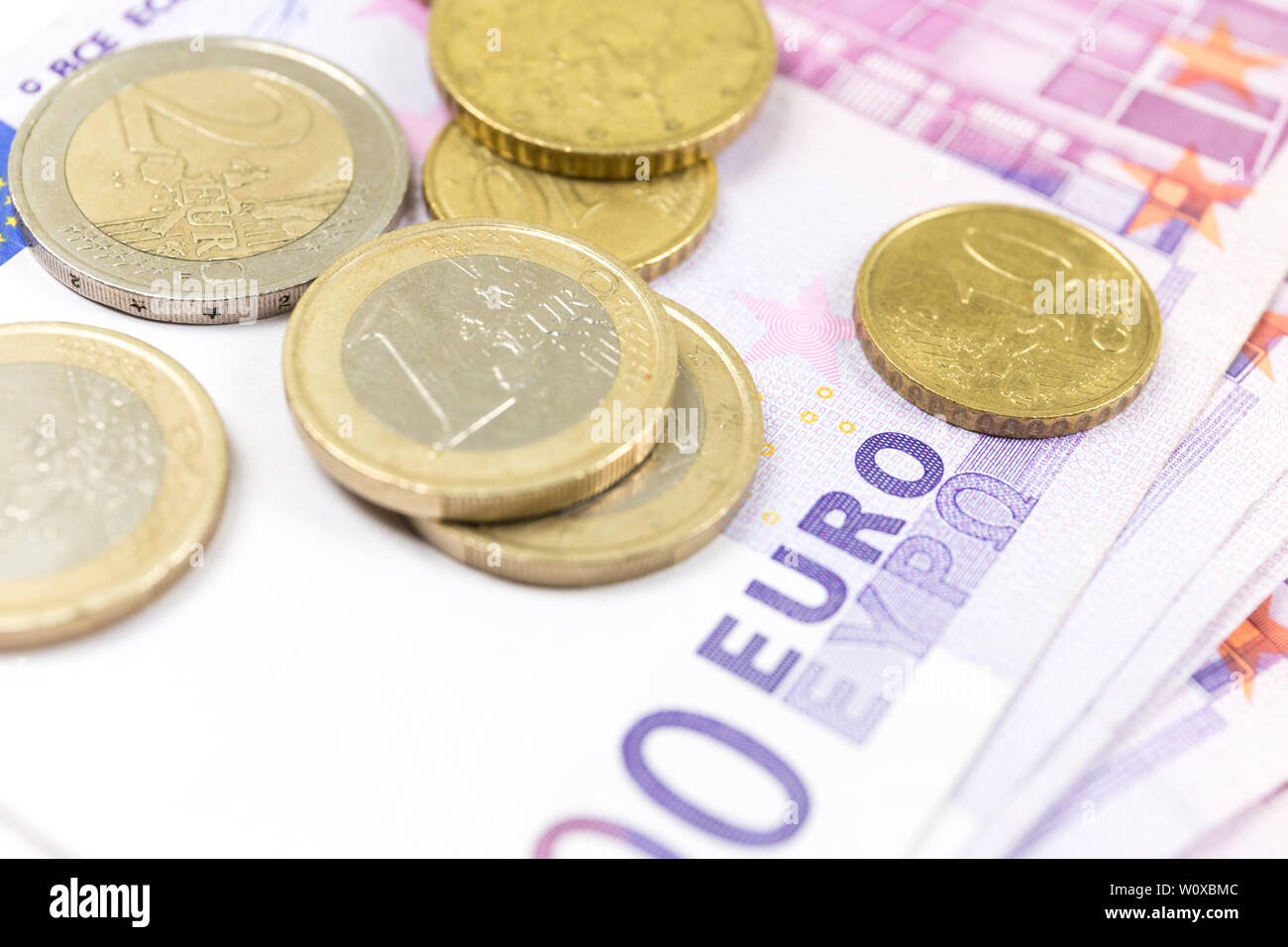 Close-up Stack of Euro banknotes and coins. 500 Euro banknotes ...