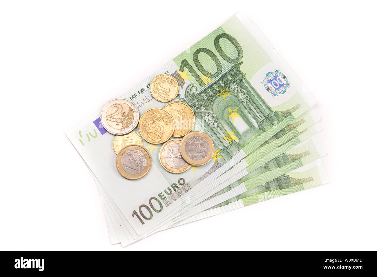 Stack of Euro banknotes and coins isolated. 100 Euro banknotes ...