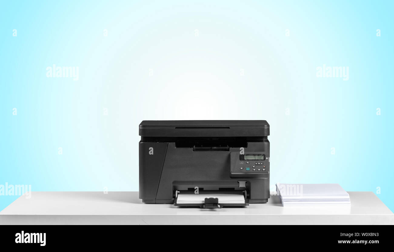 Printer copier machine on a bright colored background Stock Photo - Alamy