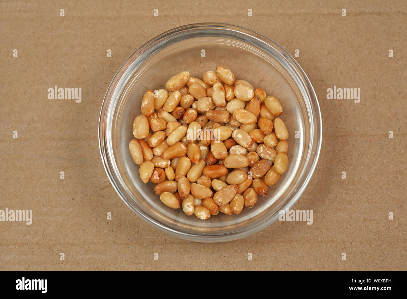 Organic Pine Nuts Snacks in Glass Bowl Stock Photo - Alamy