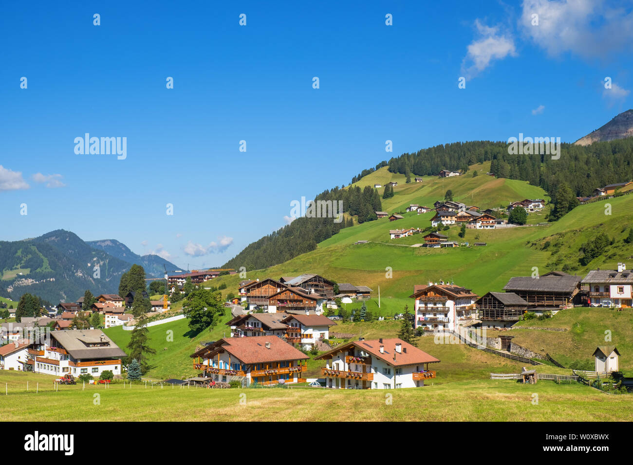 View with residential buildings in the Alps Stock Photo - Alamy
