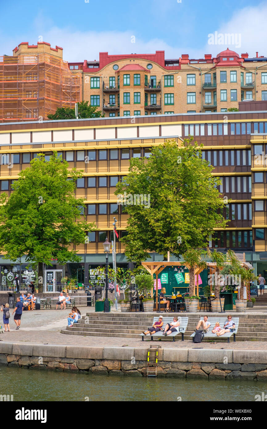 Cityscape view with resting people, at the quay in Gothenburg, Sweden ...