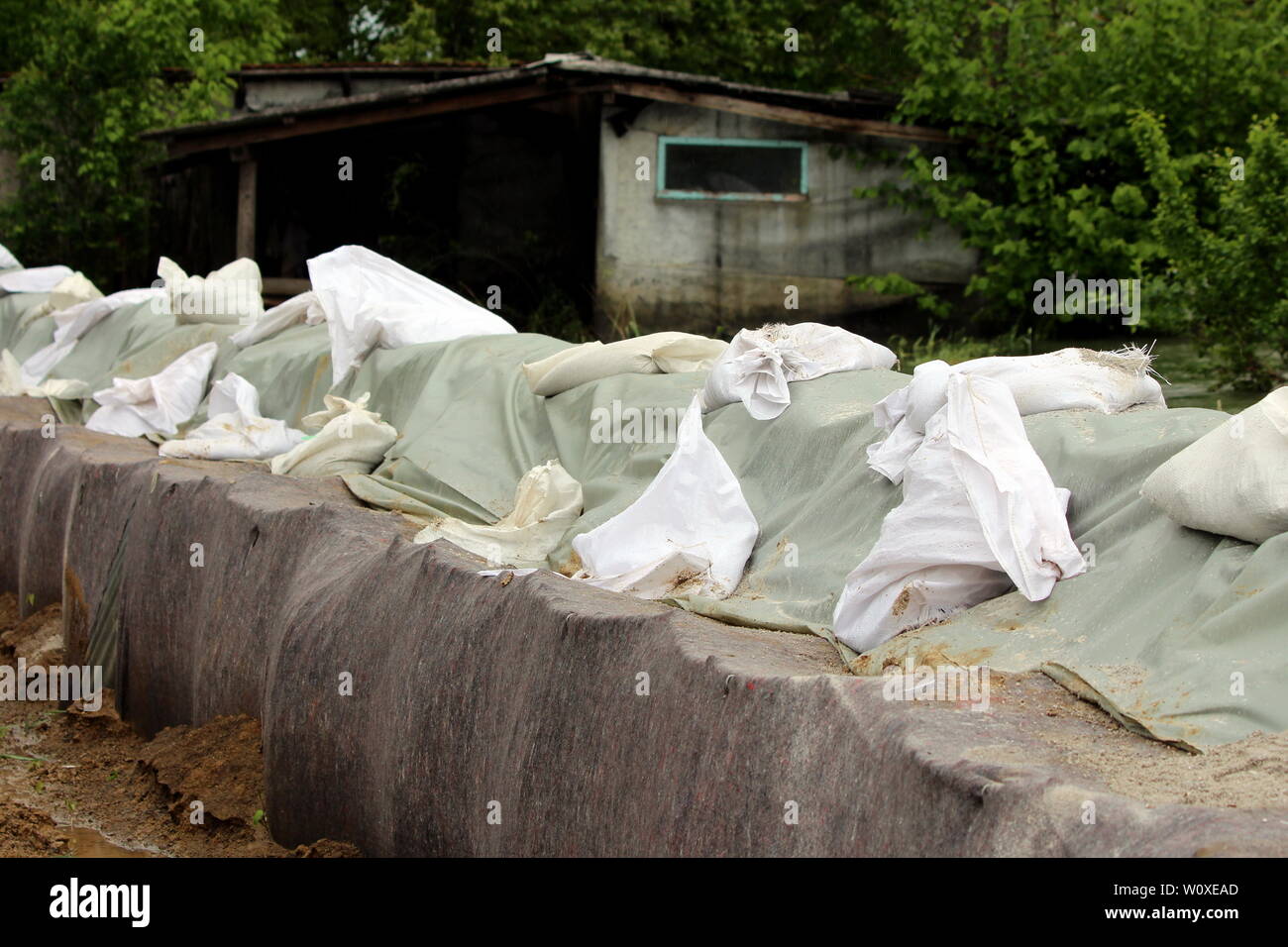 Line of temporary flood protection wall made of box barriers and ...