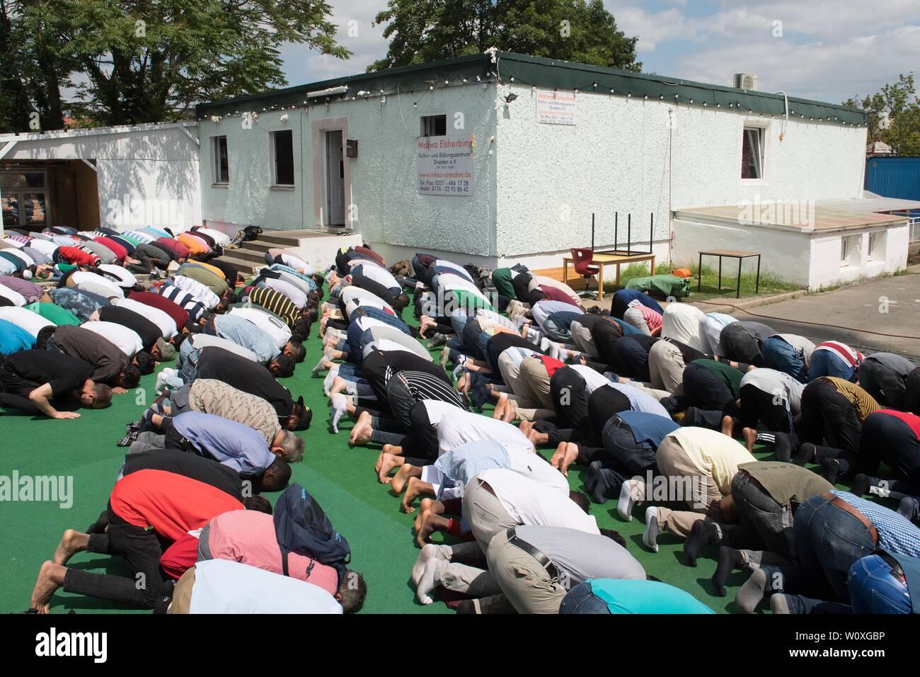 28 June 2019, Saxony, Dresden: Believers kneel in front of the Marwa El ...