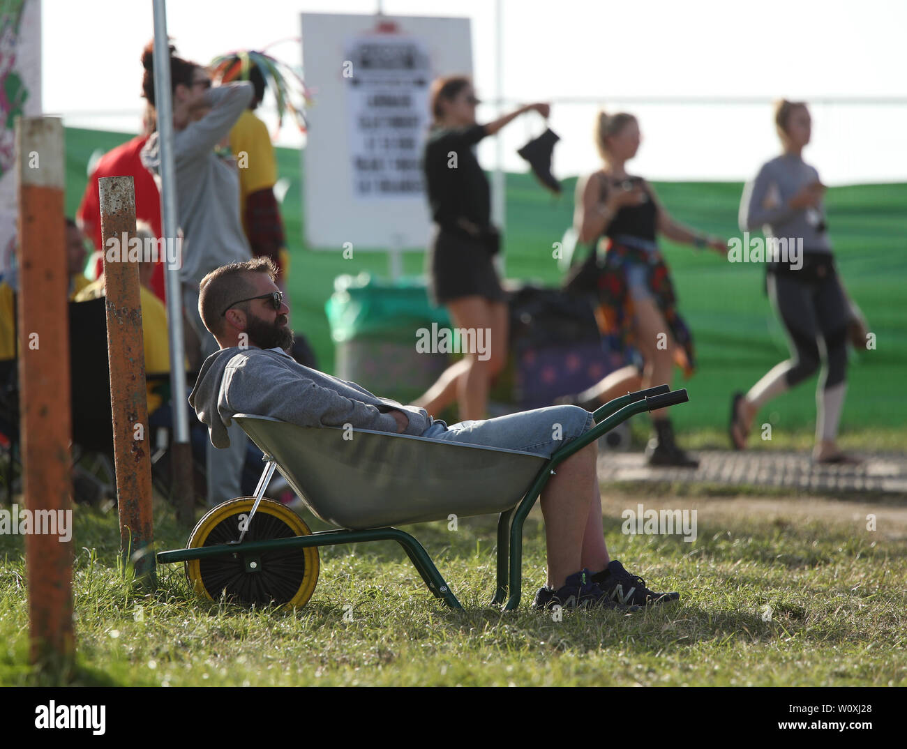 A festival goer resting hi-res stock photography and images - Alamy