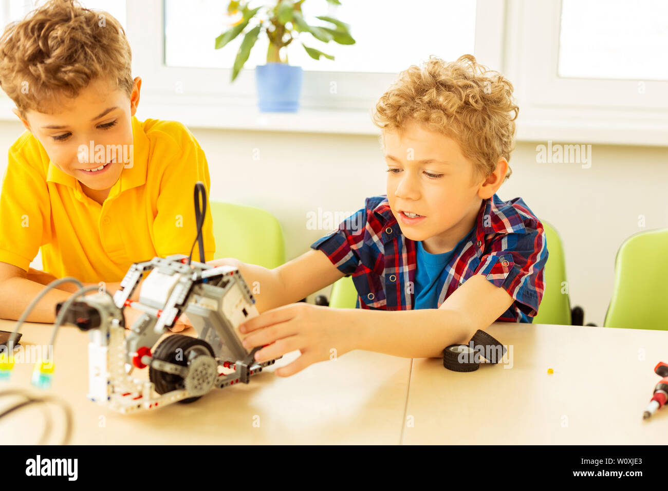 Science engineering. Nice interested boys working on the project while ...