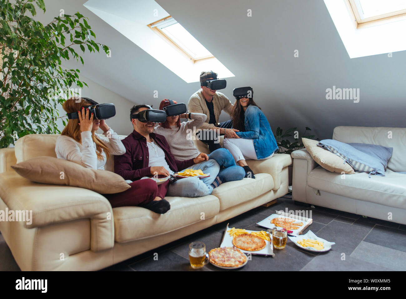 Group of happy friends bonding at home - Young adults having party and ...