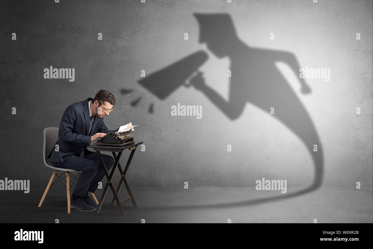 Hard working businessman shadow yelling to himself concept Stock Photo ...