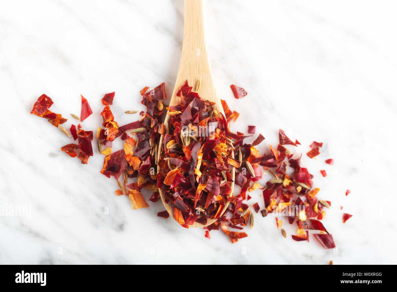 Spicy Chili paste mix with peppers on stone background. This condiment ...
