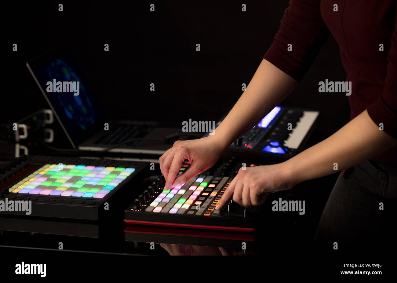 Dj hand remixing music on midi controller Stock Photo - Alamy