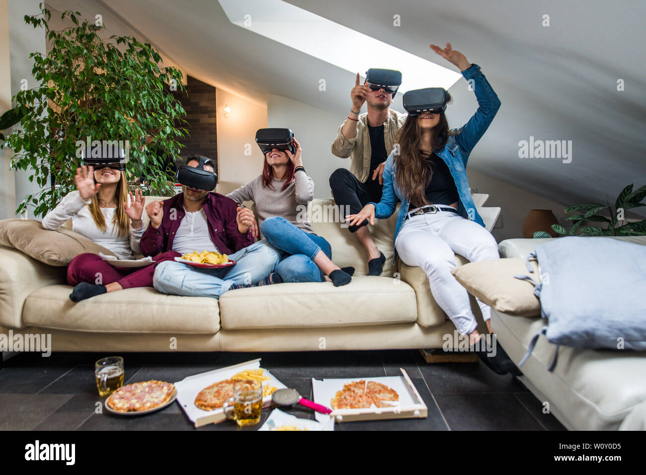 Group of happy friends bonding at home - Young adults having party and ...