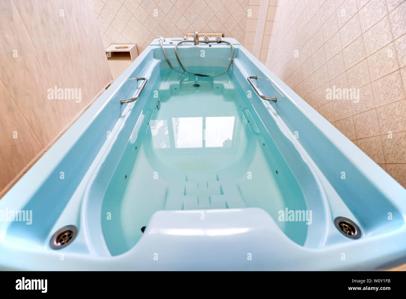 View of modern Jacuzzi bath filled with water Stock Photo - Alamy