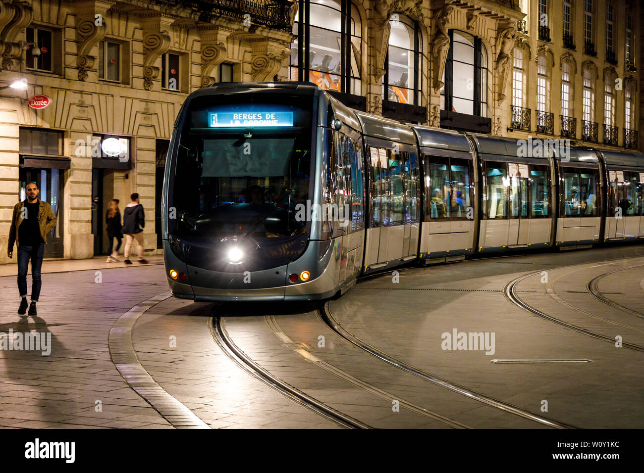 Bordeaux tramway network, newly opened in 2003, running here at night ...