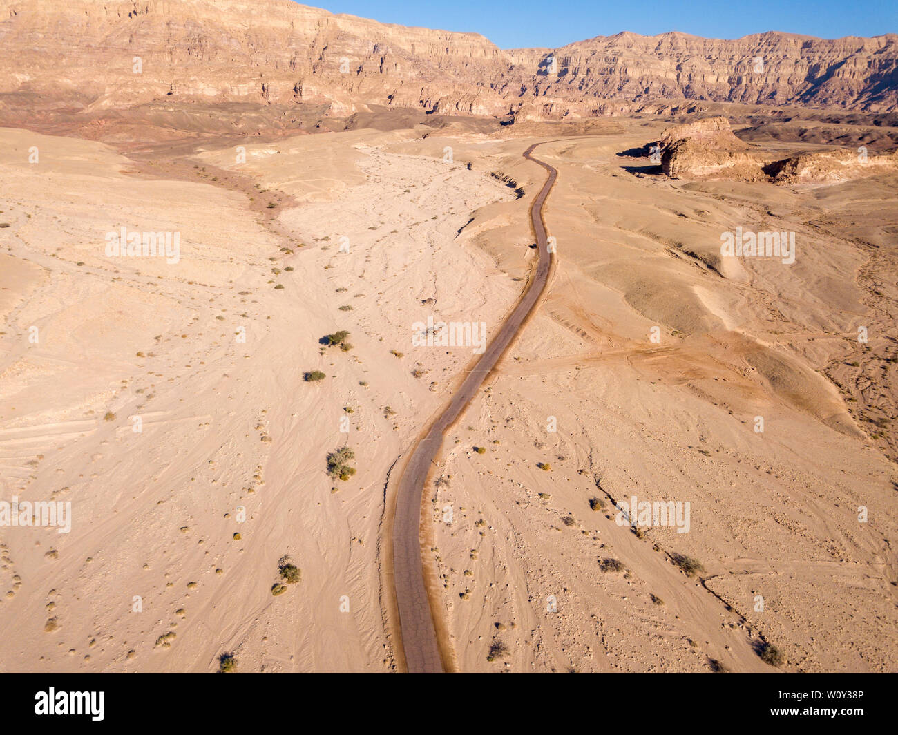 Old Desert road with cracked asphalt, Top down aerial image Stock Photo ...