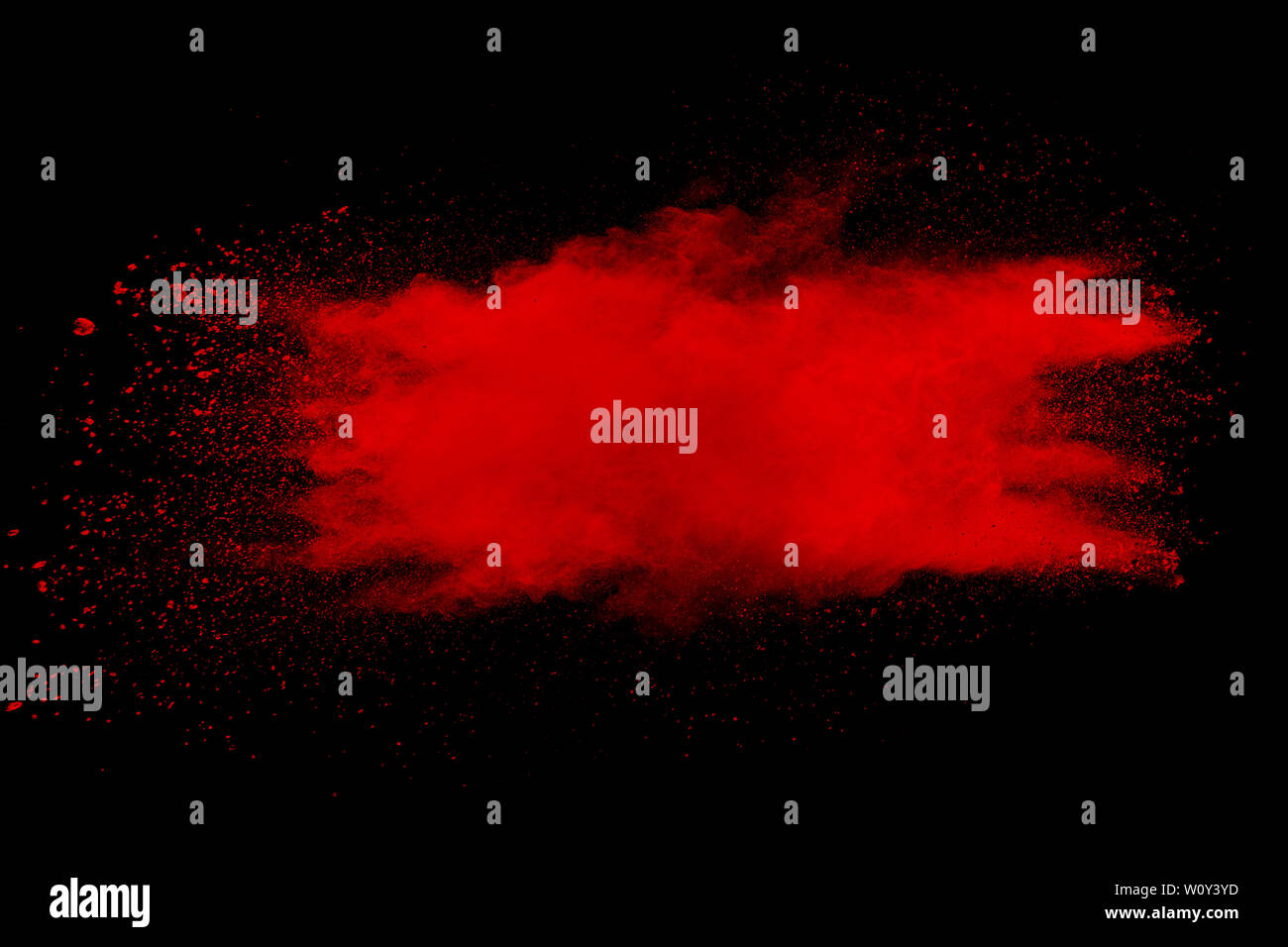 Red color powder explosion on black background.Freeze motion of red ...