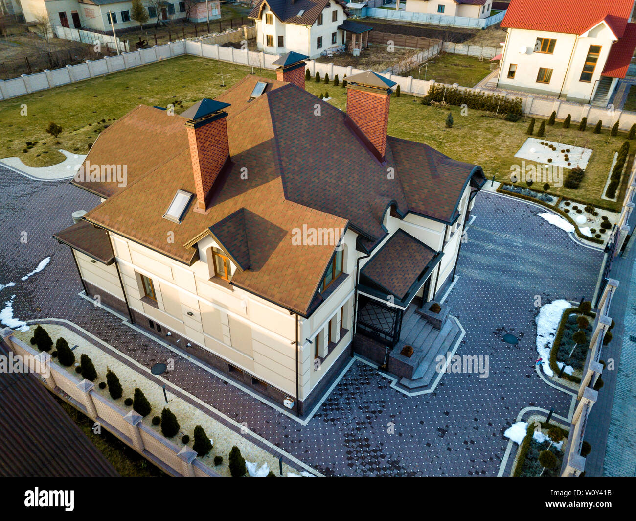 Aerial top view of new residential house cottage with shingle roof on ...