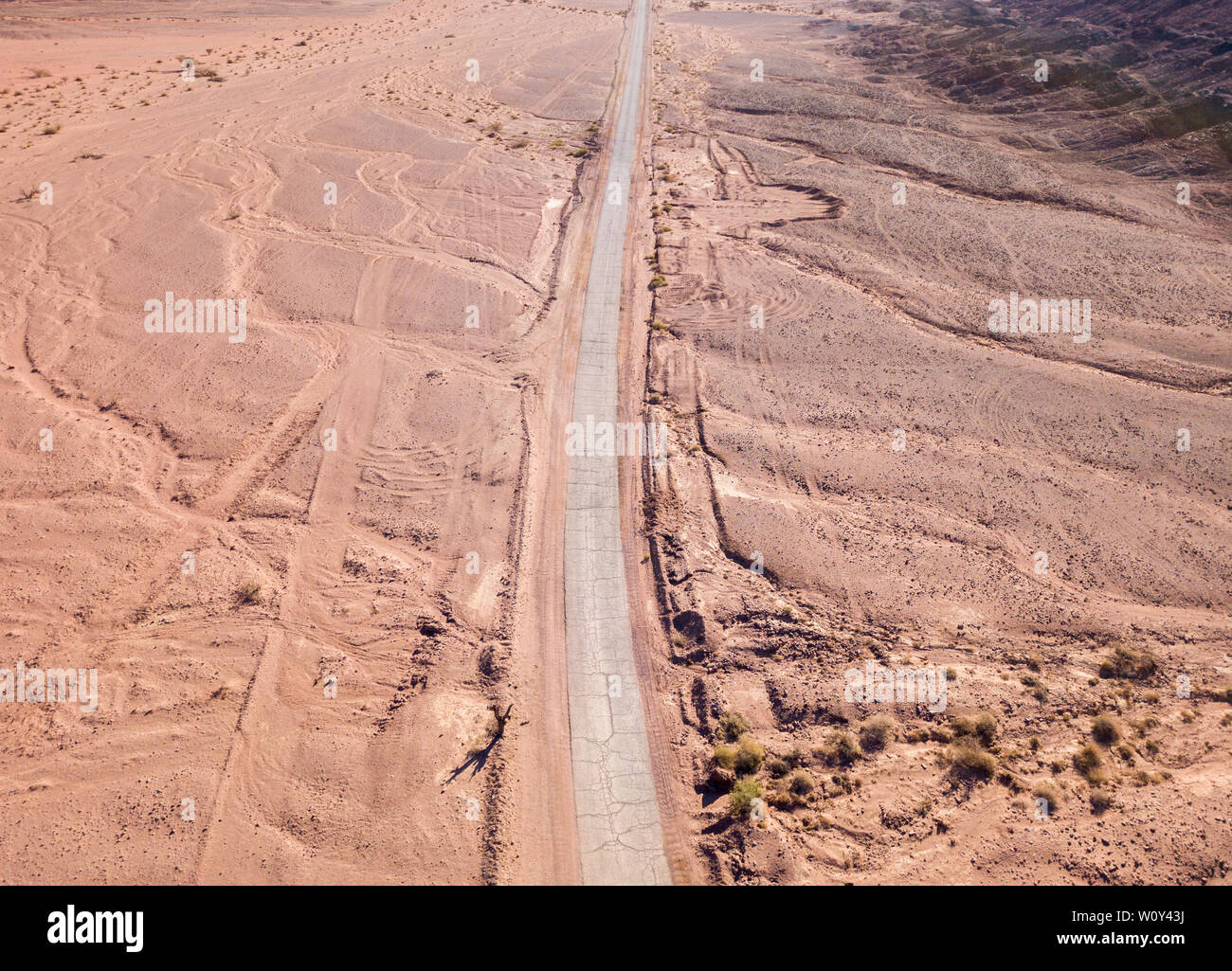 Old Desert road with cracked asphalt, Top down aerial image Stock Photo ...