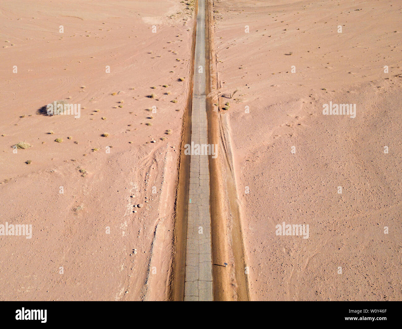 Old Desert road with cracked asphalt, Top down aerial image Stock Photo ...