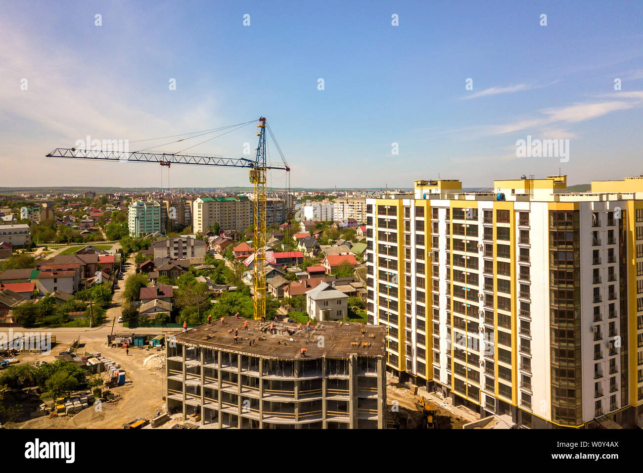 Apartment or office tall building under construction. Working builders ...