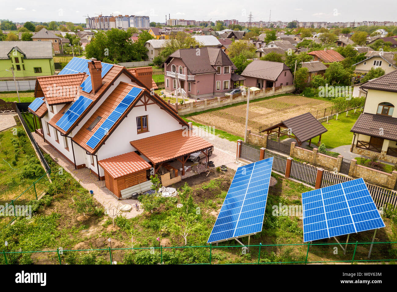 Aerial top view of new modern residential house cottage with blue shiny ...