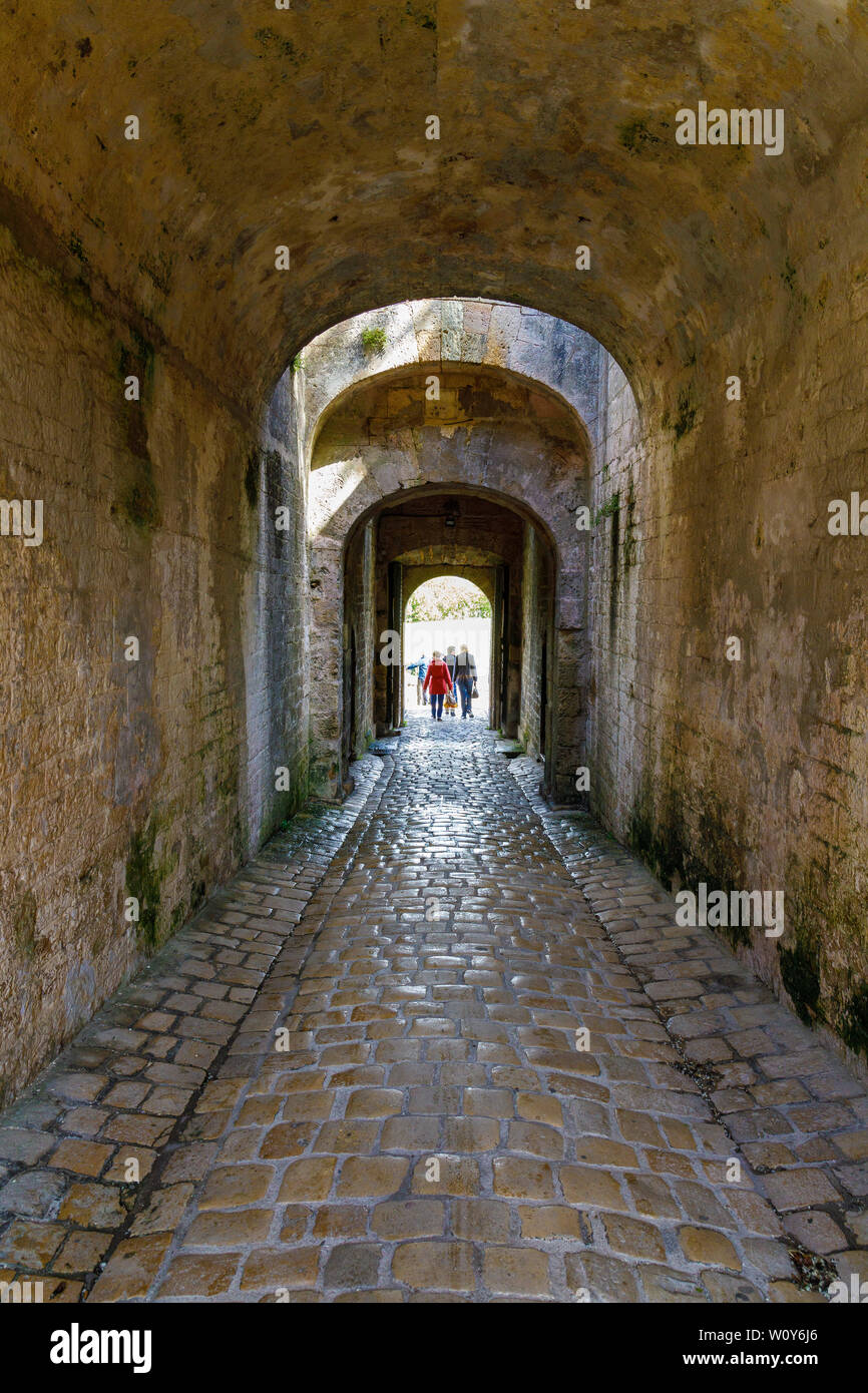 A cobbled stone passageway through the walls of the Citadel at Blaye ...