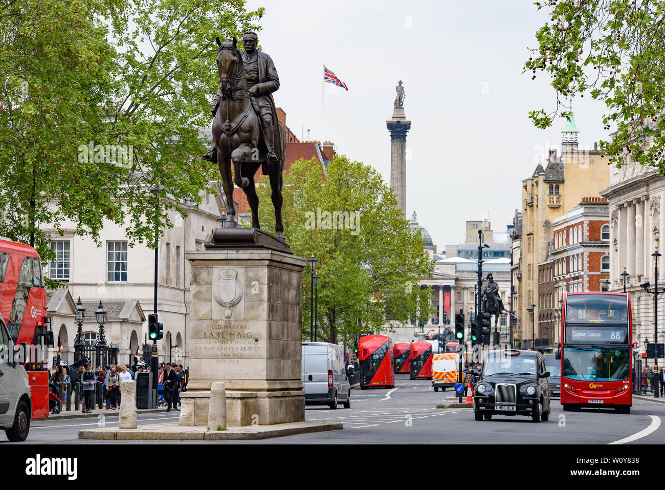 British taxi and bus on Parliament St in London, United Kingdom Stock ...