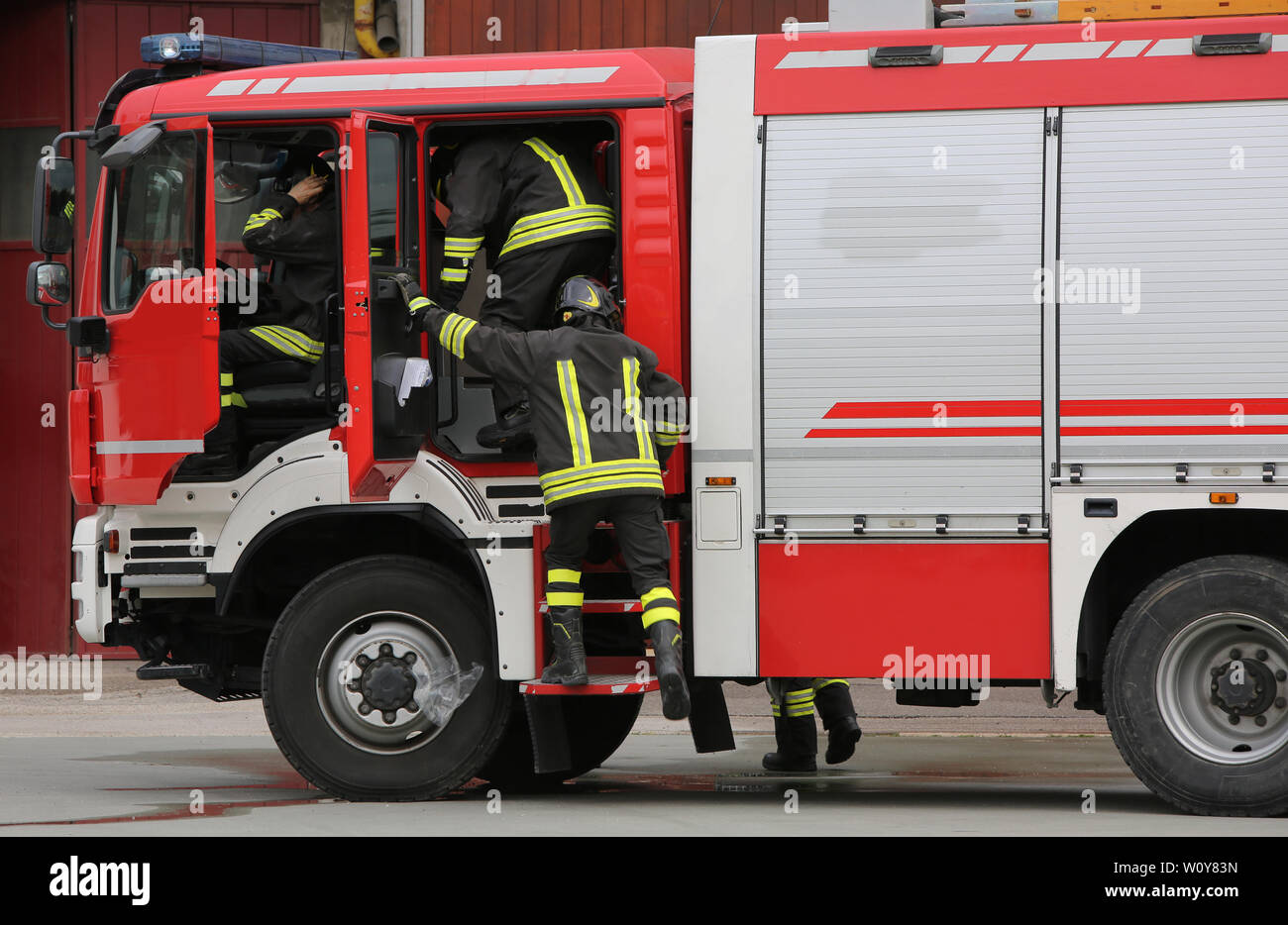 firefighters and the fire engine during a fire drill Stock Photo - Alamy