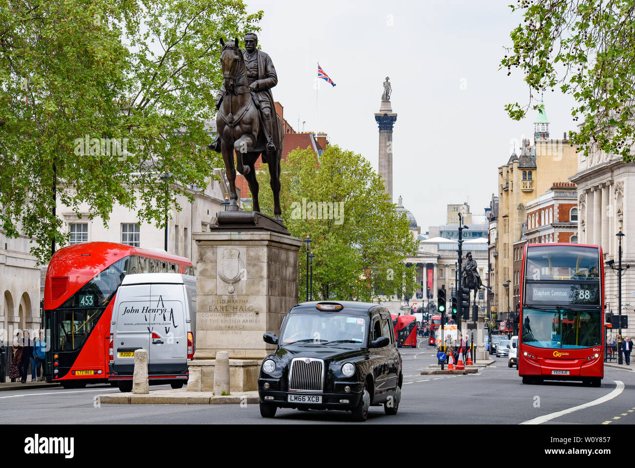 British taxi and bus on Parliament St in London, United Kingdom Stock ...
