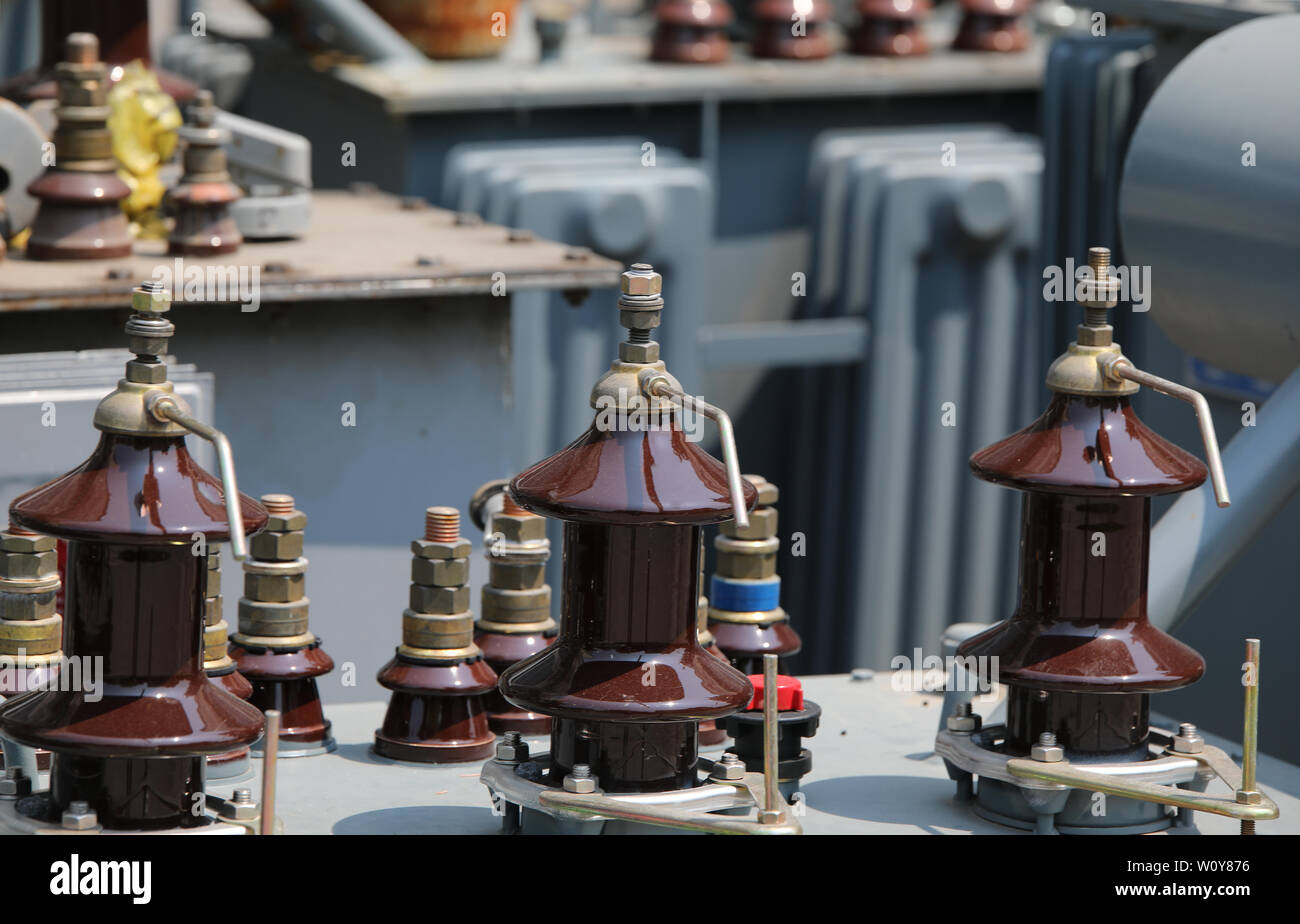 detail of a high voltage electrical transformer with connectors to ...