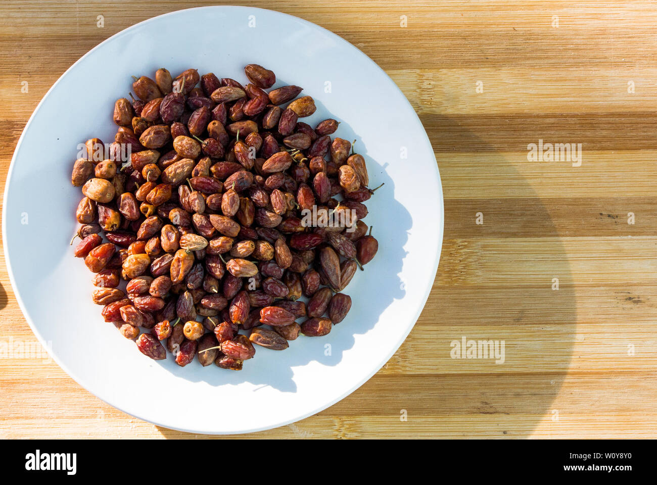 Sweet dried wild fruits from pink or red ivory tree known as nyii Stock ...