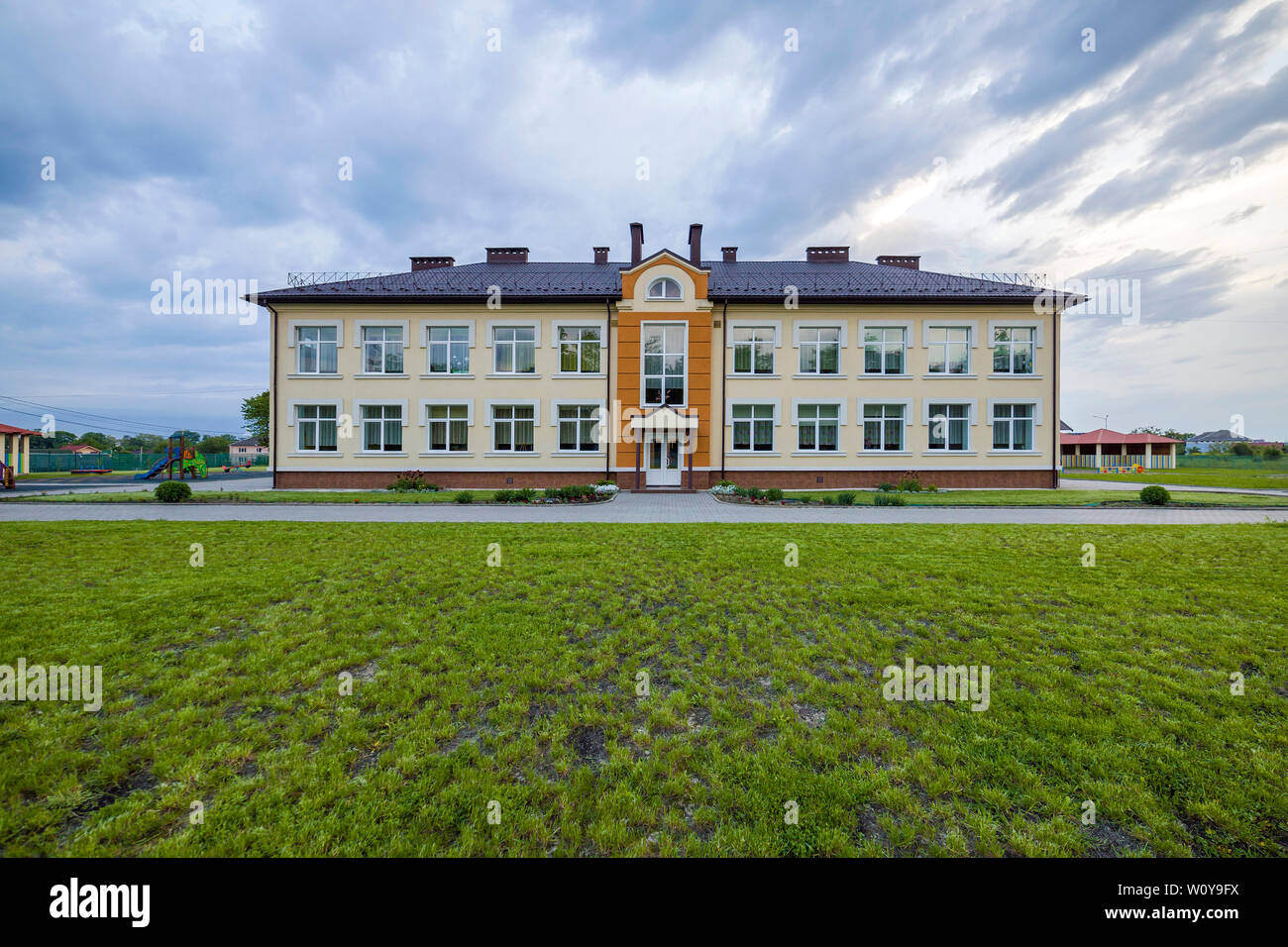 New modern two-storied kindergarten preschool building with big windows ...